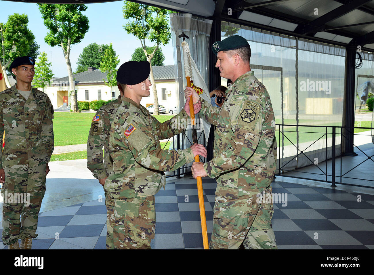 Capt. Brenna T. Roorda, incoming Company Commander, left, receives the ...