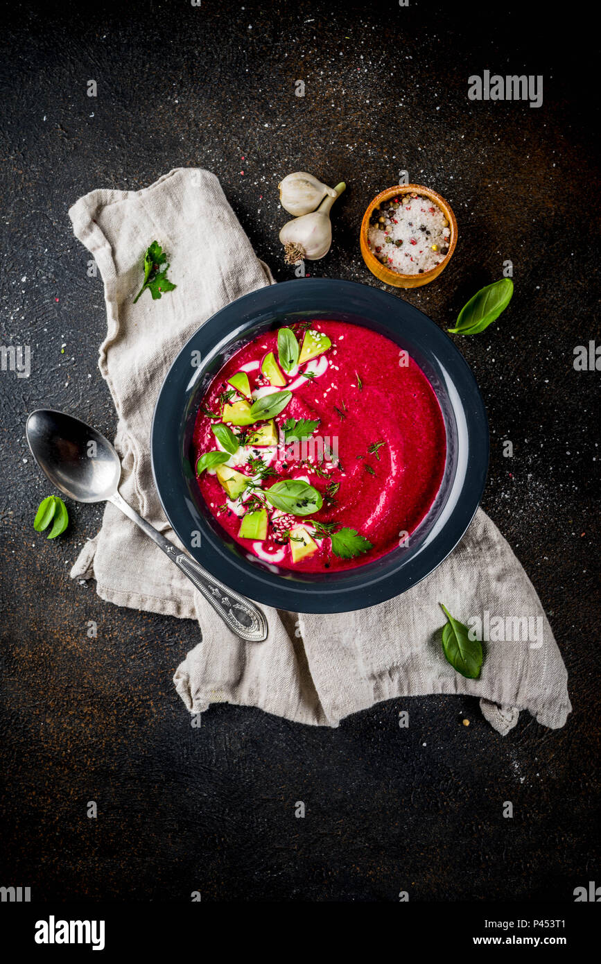 Vegan food, summer cold Beetroot gazpacho soup with lemon, avocado and ...