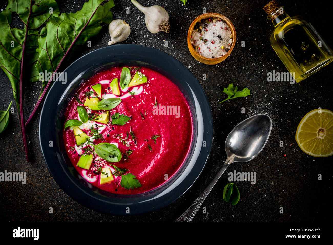 Vegan food, summer cold Beetroot gazpacho soup with lemon, avocado and ...