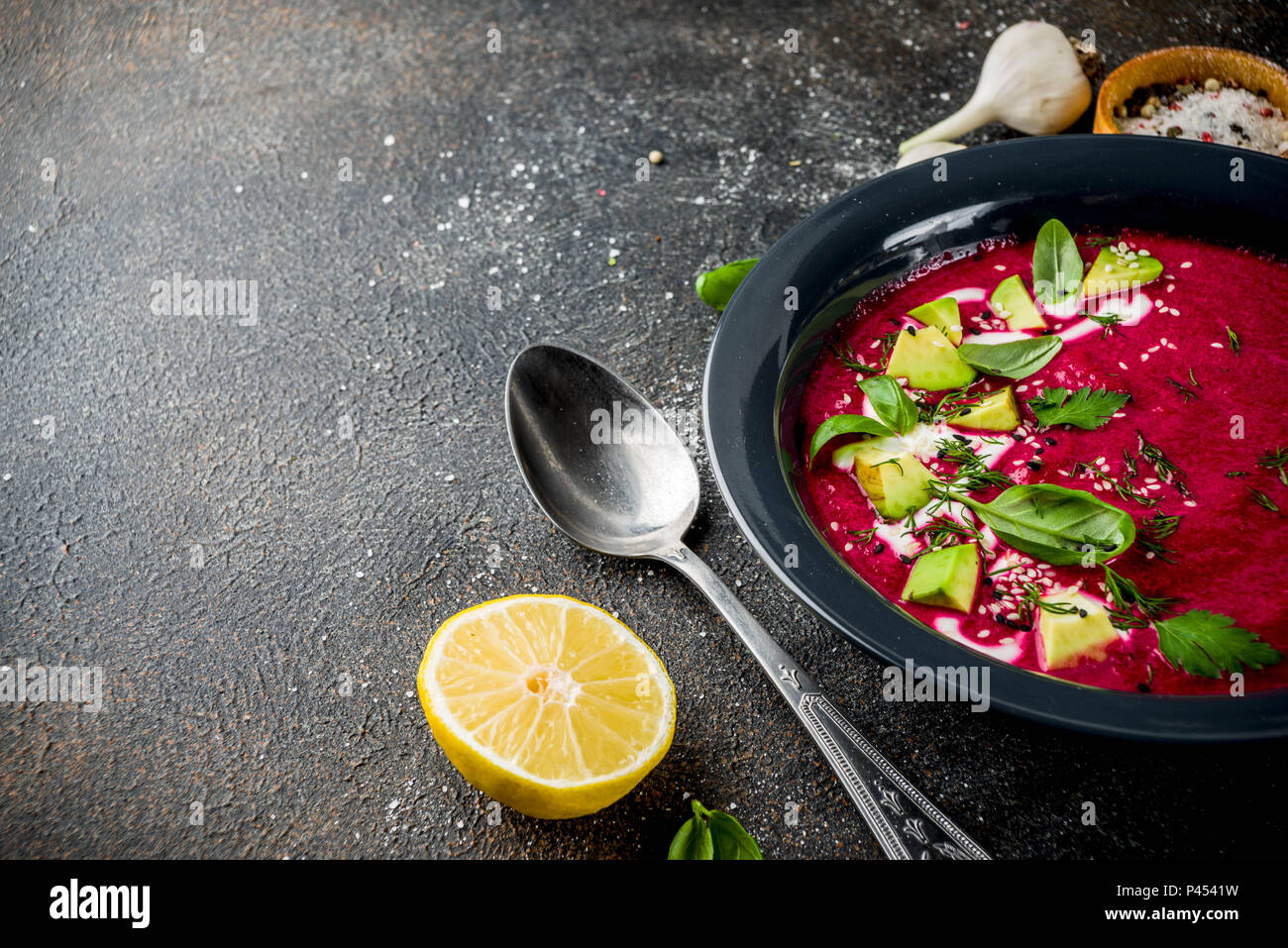 Vegan food, summer cold Beetroot gazpacho soup with lemon, avocado and ...
