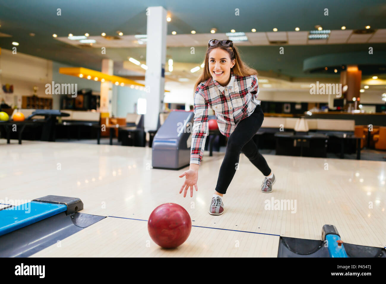 Beautiful woman bowling Stock Photo - Alamy