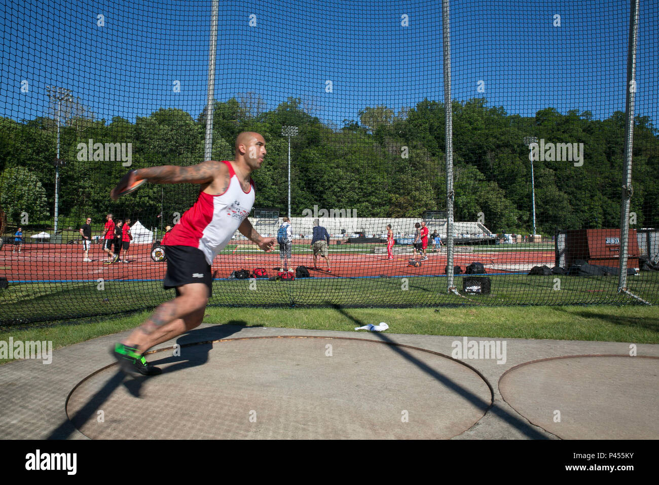 U.S. Marine Corps veteran Andrew Anderson spins into a discus throw ...