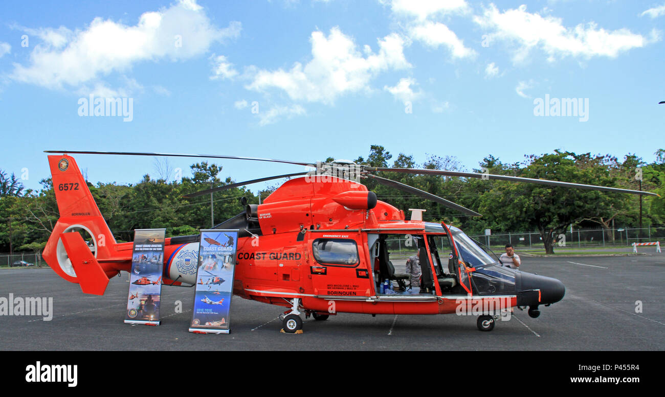 A Coast Guard Air Station Borinquen MH-65D Dolphin helicopter is ...