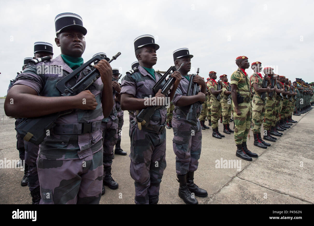 Military members from the Gabonese Armed Forces stand in formation ...