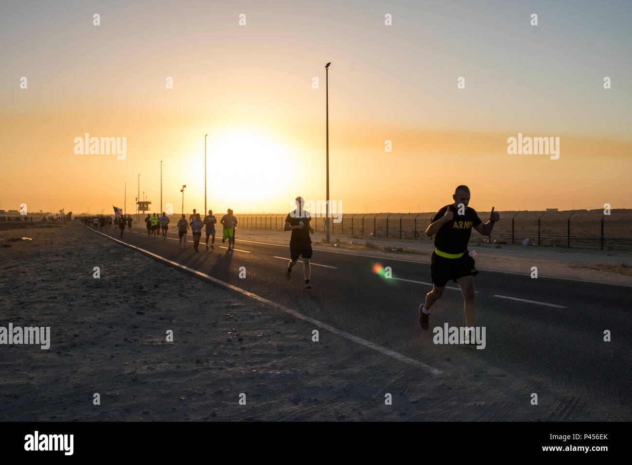 Troops run a 10k race together in celebration of the U.S. Army’s 241st ...