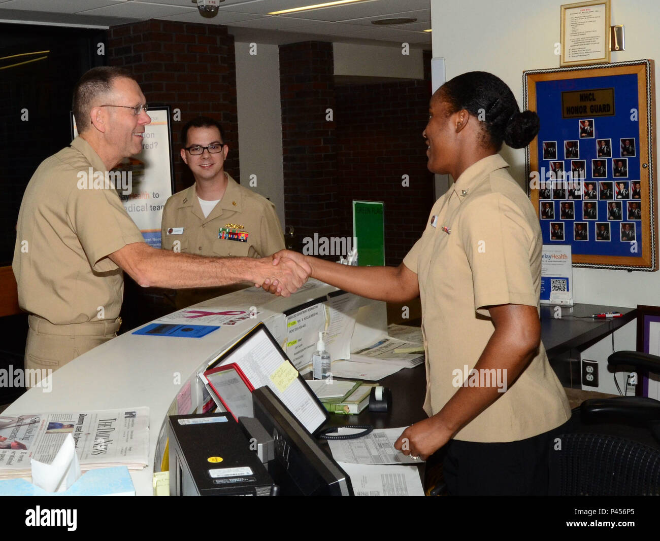 Rear Adm. Kenneth Iverson, commander of Navy Medicine East,greets ...