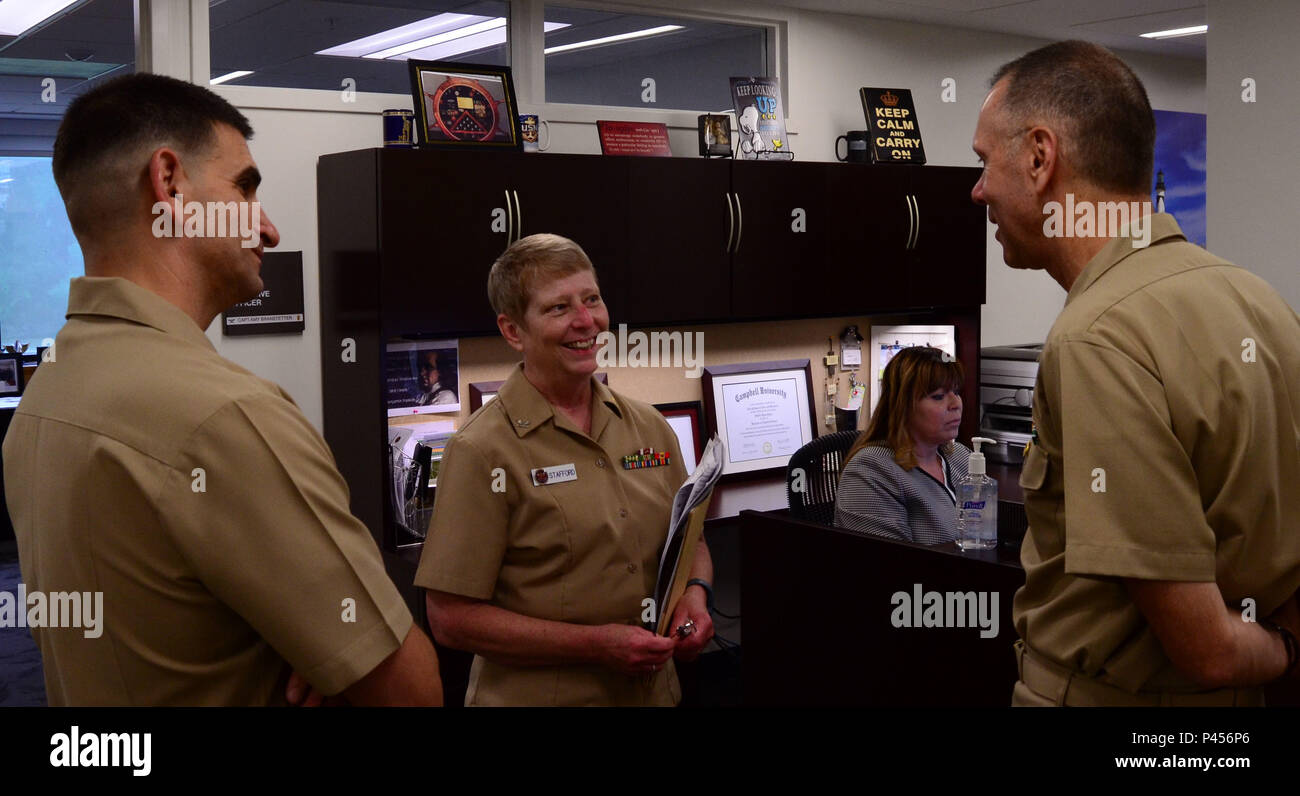Capt. Donna Stafford, director nursing services, speaks with Capt. Rick ...