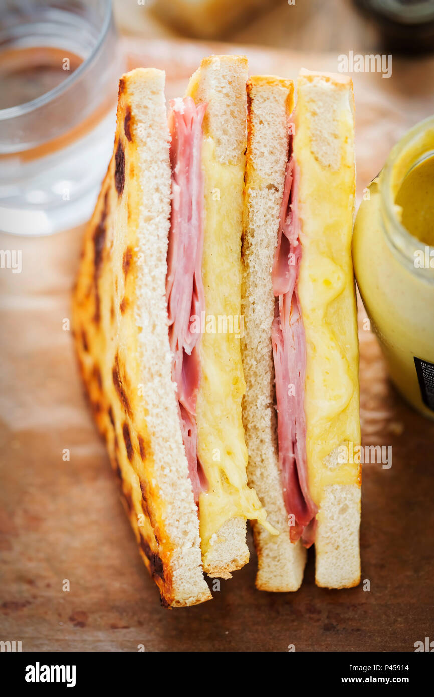 Ham cheddar cheese toastie. Bread with ham, cheese & mustard sauce & grilled cheddar and ...