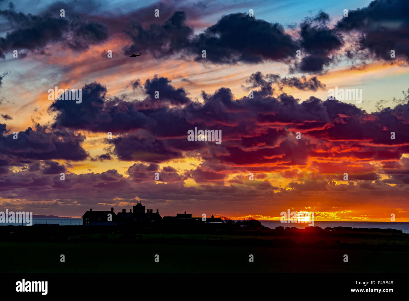 Helicopter over Rest Bay Hotel at sunset, Porthcawl, Wales Stock Photo ...