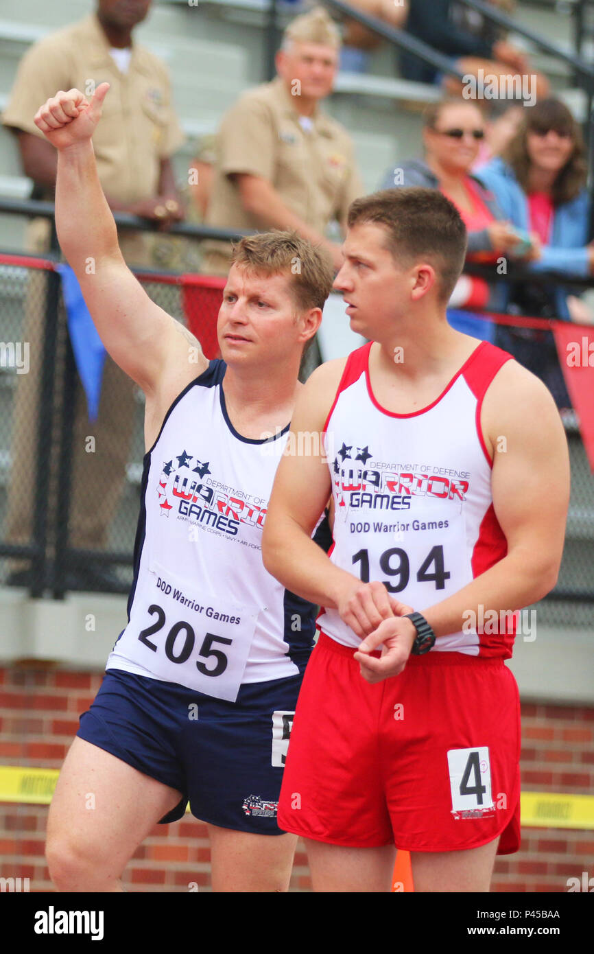 Navy Chief Petty Officer Ron Condrey (left), of Salisbury, N.C., gives ...