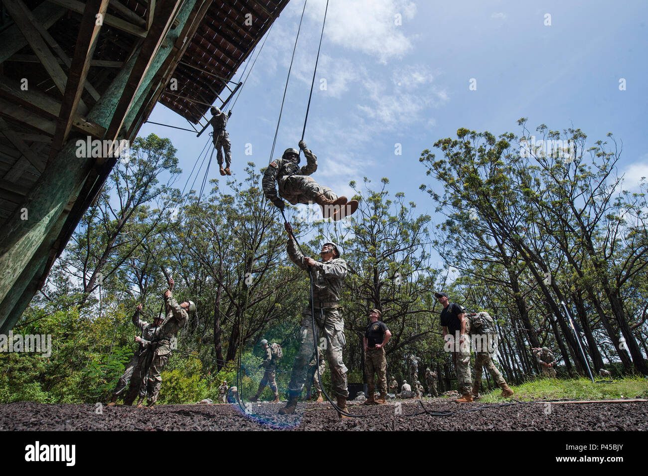 U.S. Army Soldiers rappel off of a tower as part of the 25th Infantry ...