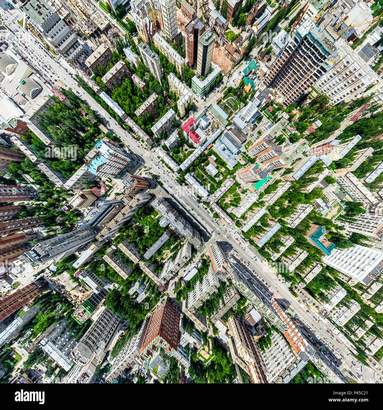 Aerial city view with crossroads and roads, houses, buildings, parks ...