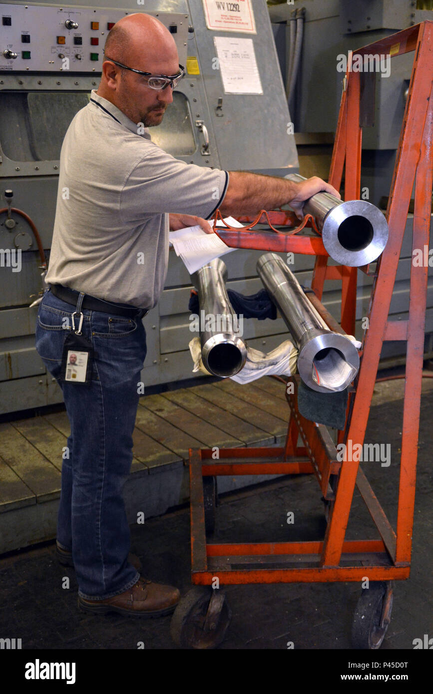 Watervliet Arsenal Machinist Steve Luther is preparing a 81 mm mortar ...