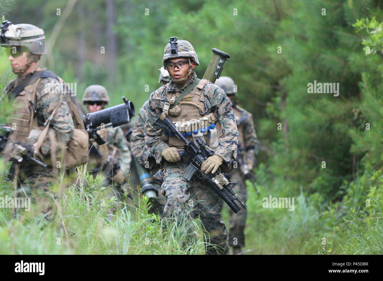 Marines with 2nd Battalion, 8th Marine Regiment await the arrival of a MV-22 Osprey during a ...