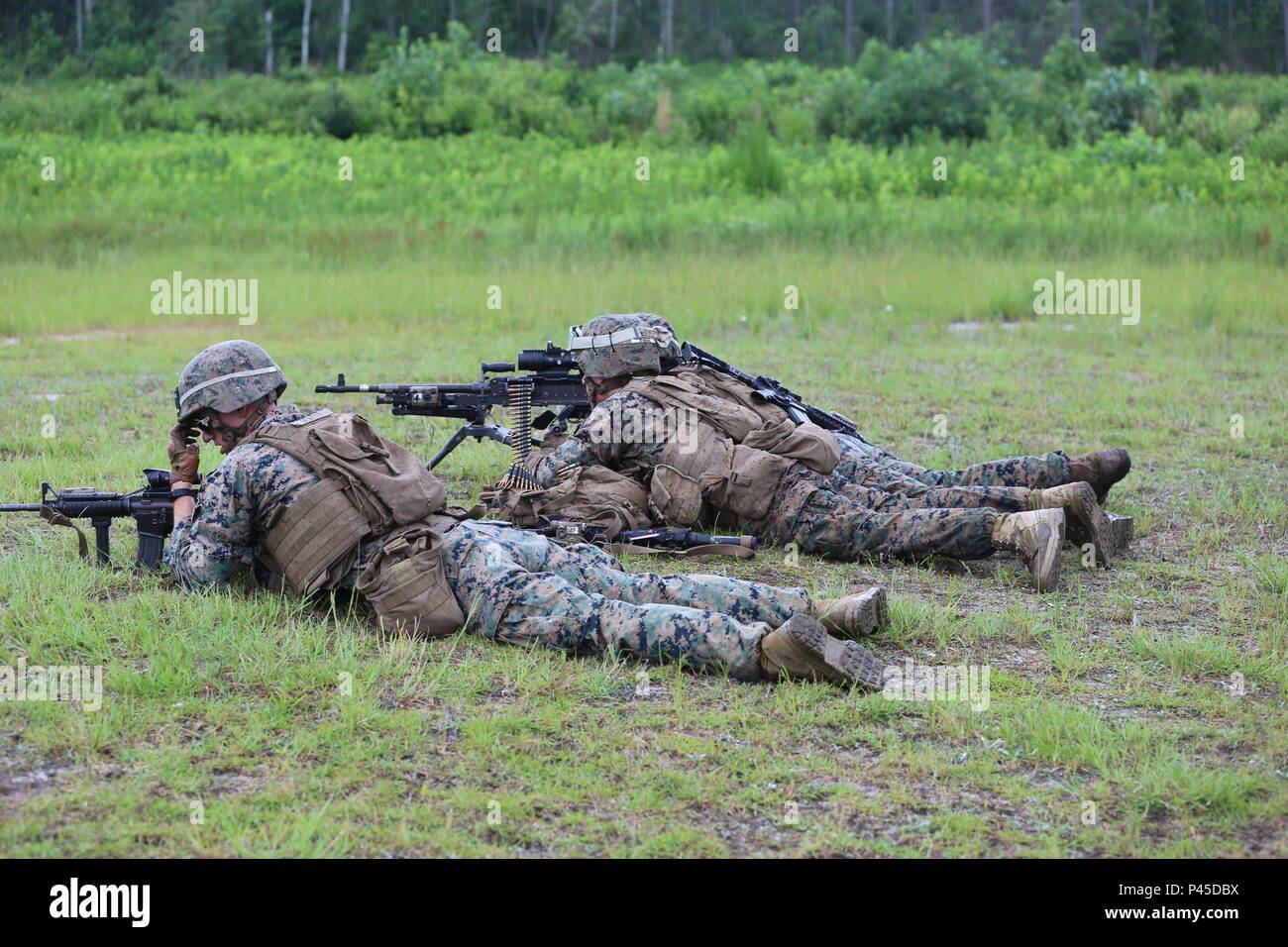 Marines with 2nd Battalion, 8th Marine Regiment await the arrival of a MV-22 Osprey during a ...