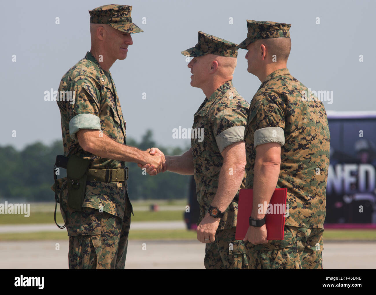 U.S. Marine Corps Col. Timothy Salmon (left), shakes hands with Brig ...