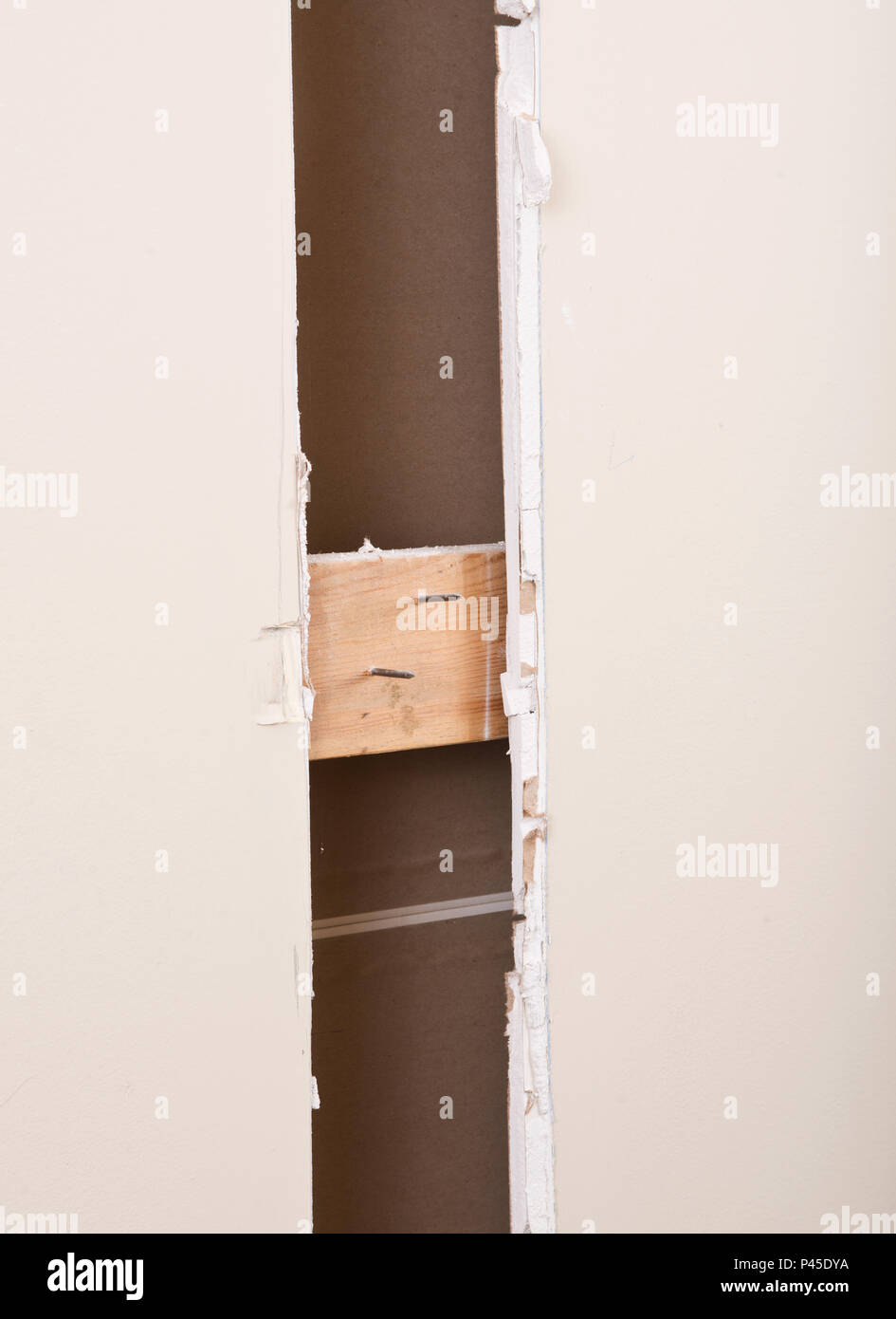 Cut drywall off wall in house under remodeling Stock Photo - Alamy