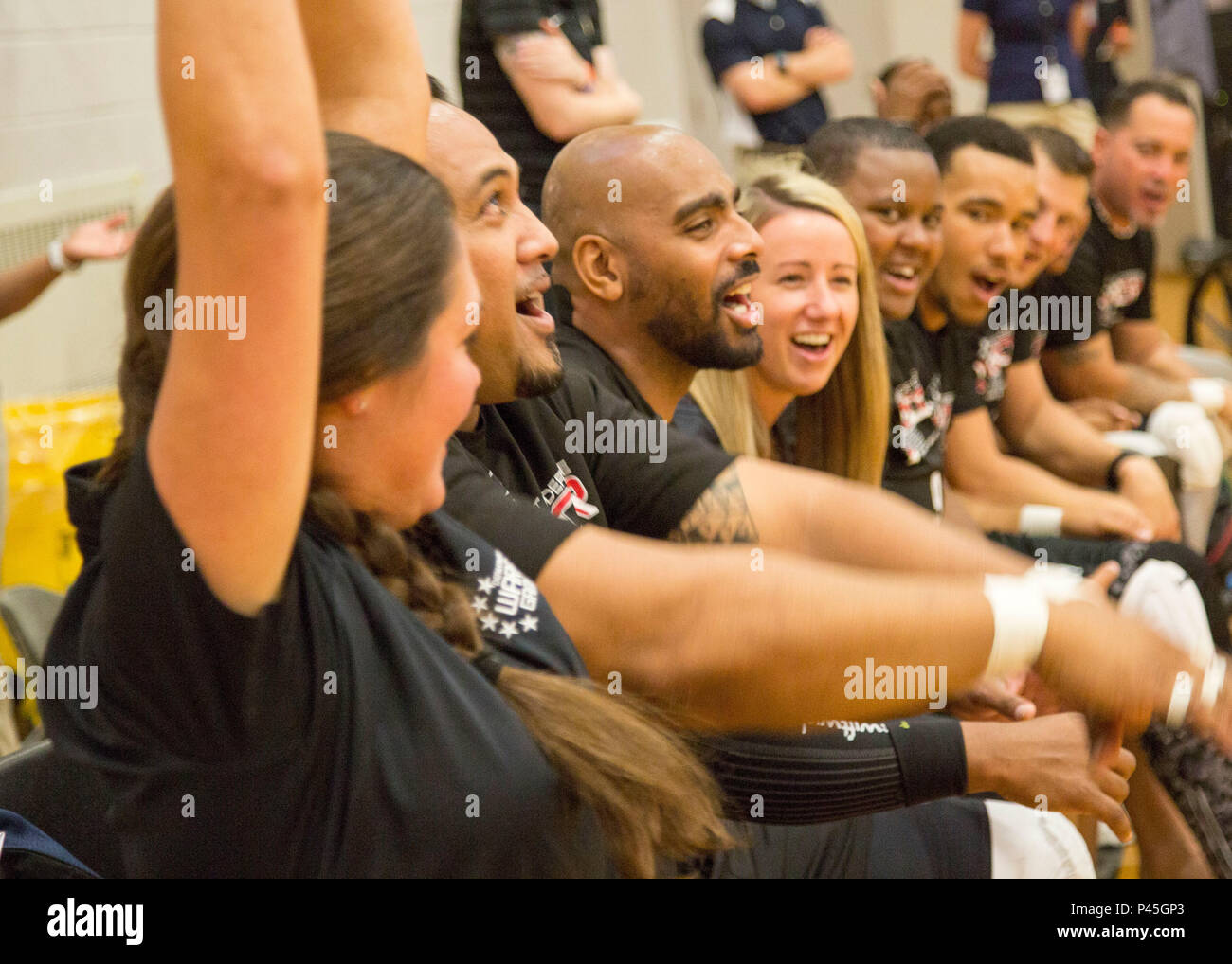 Team Army cheers after their teammates score a point during a 2016 ...