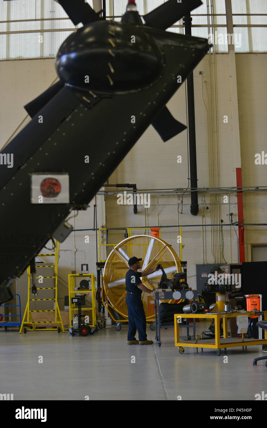 Gilberto Rodriguez, U.S. Falcon Inc. helicopter mechanic, reassembles ...
