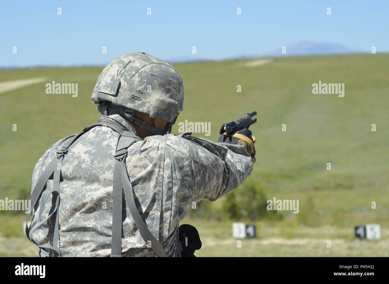 U.S. Army Spc. Riley Collins of the 235th Military Police Company fire ...