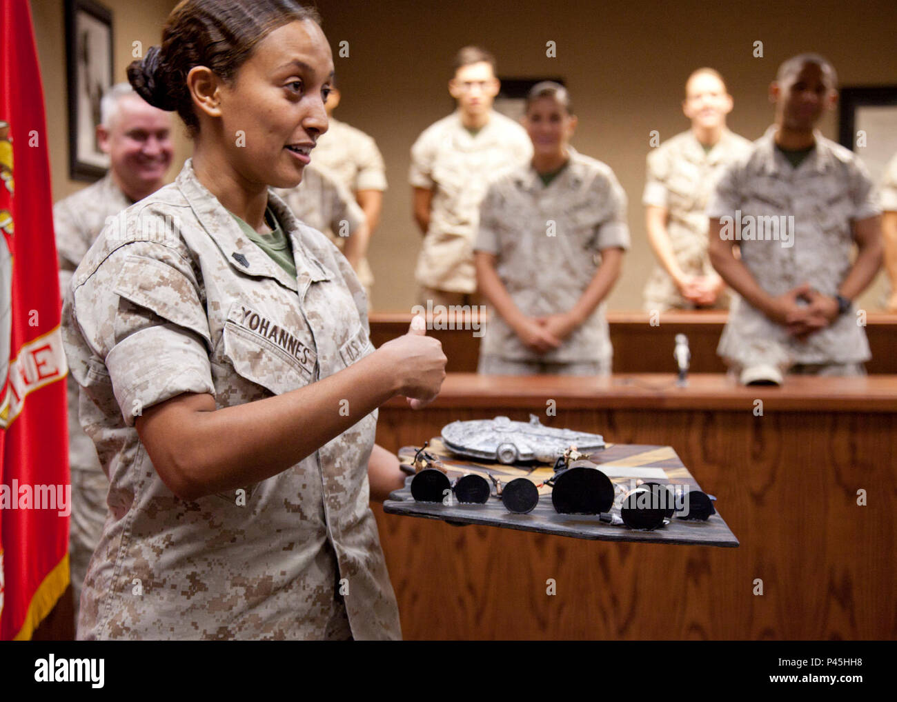 U.S. Marine Corps Sergeant Yohannes presents a personal plaque to Maj ...