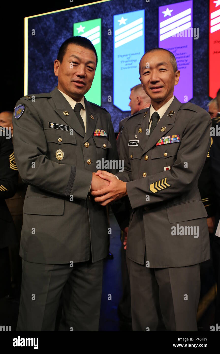 Warrant Officer Hiromori Kawahata, left, sergeant major, Japan Ground ...