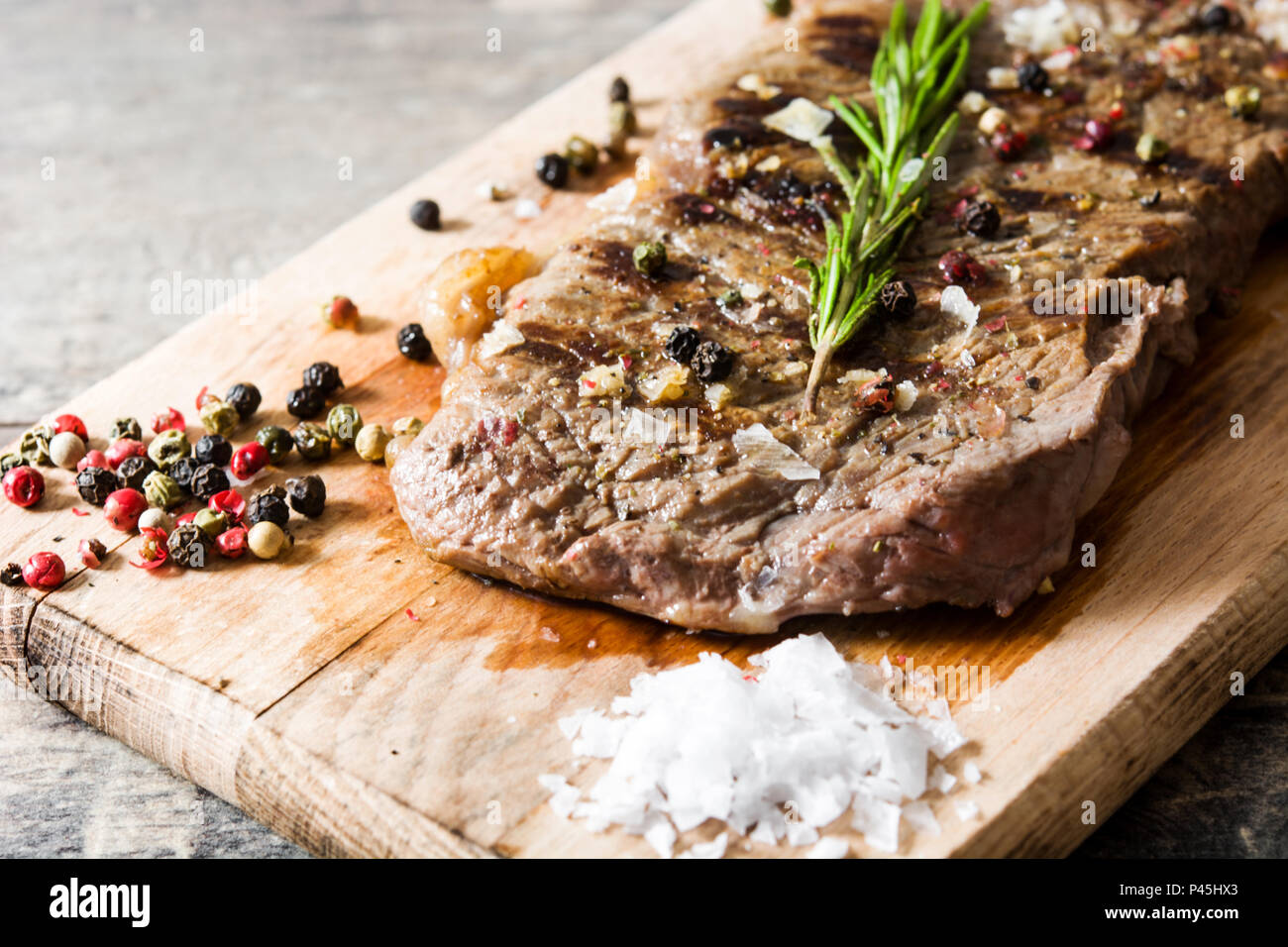 Grilled beef steak and spicy on rustic wooden background Stock Photo ...