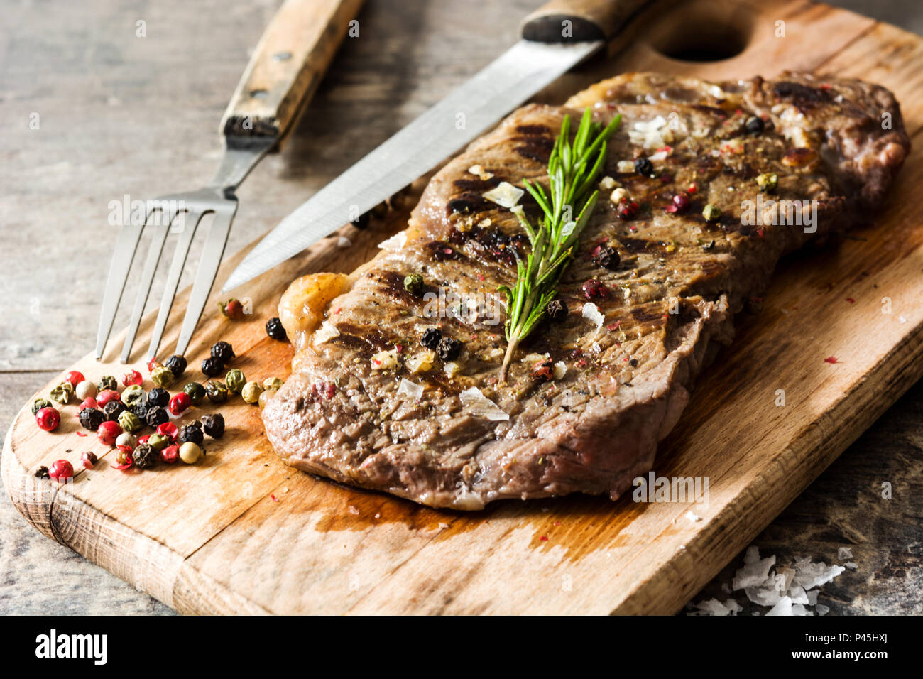 Grilled beef steak and spicy on rustic wooden background Stock Photo ...