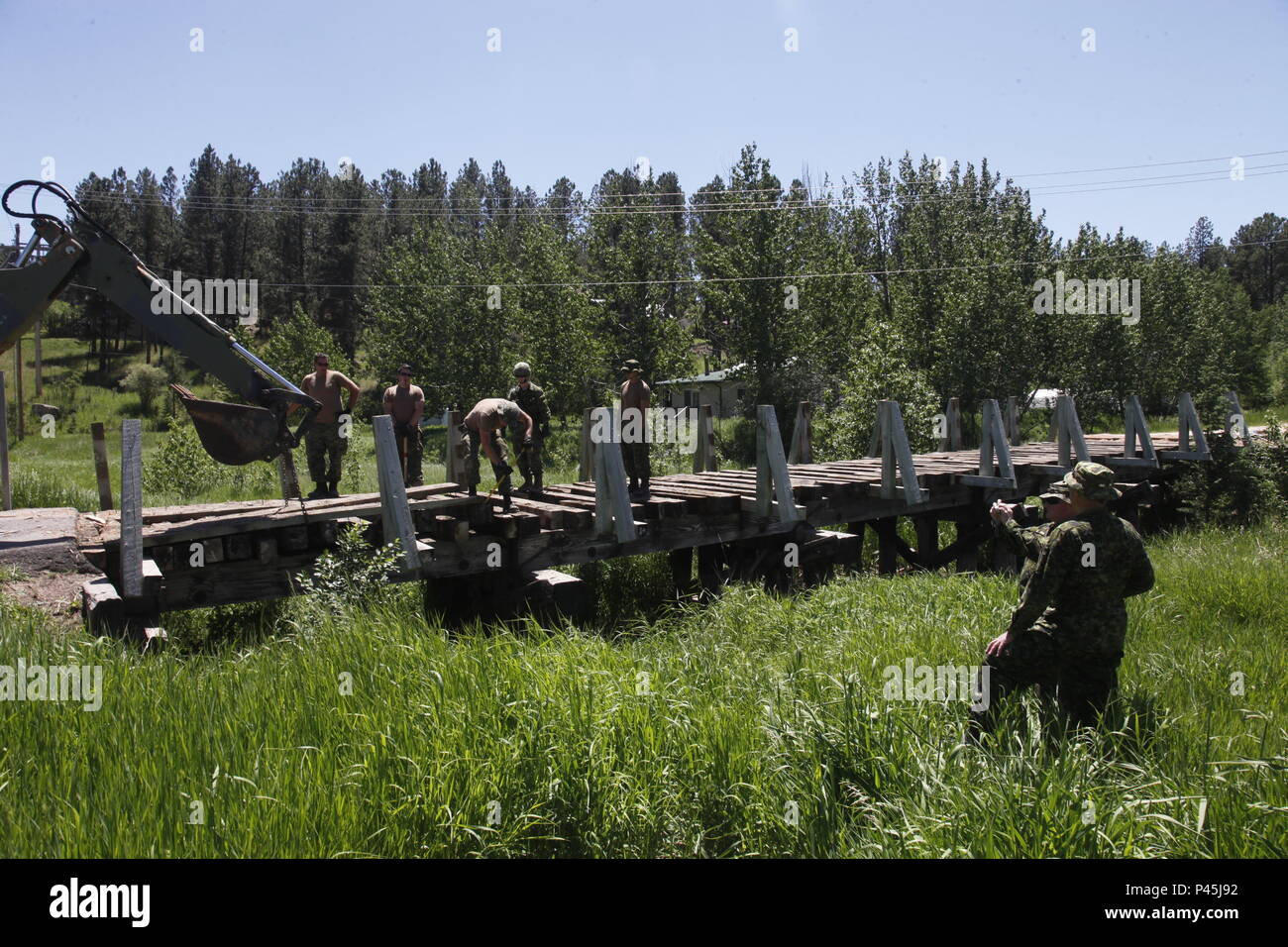 Col. John Conrad commander of the 41st Canadian Brigade Group, observes ...