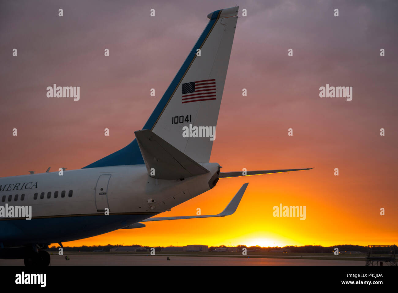 The sun rises behind an 89th Airlift Wing Special Airlift Mission C-40B ...