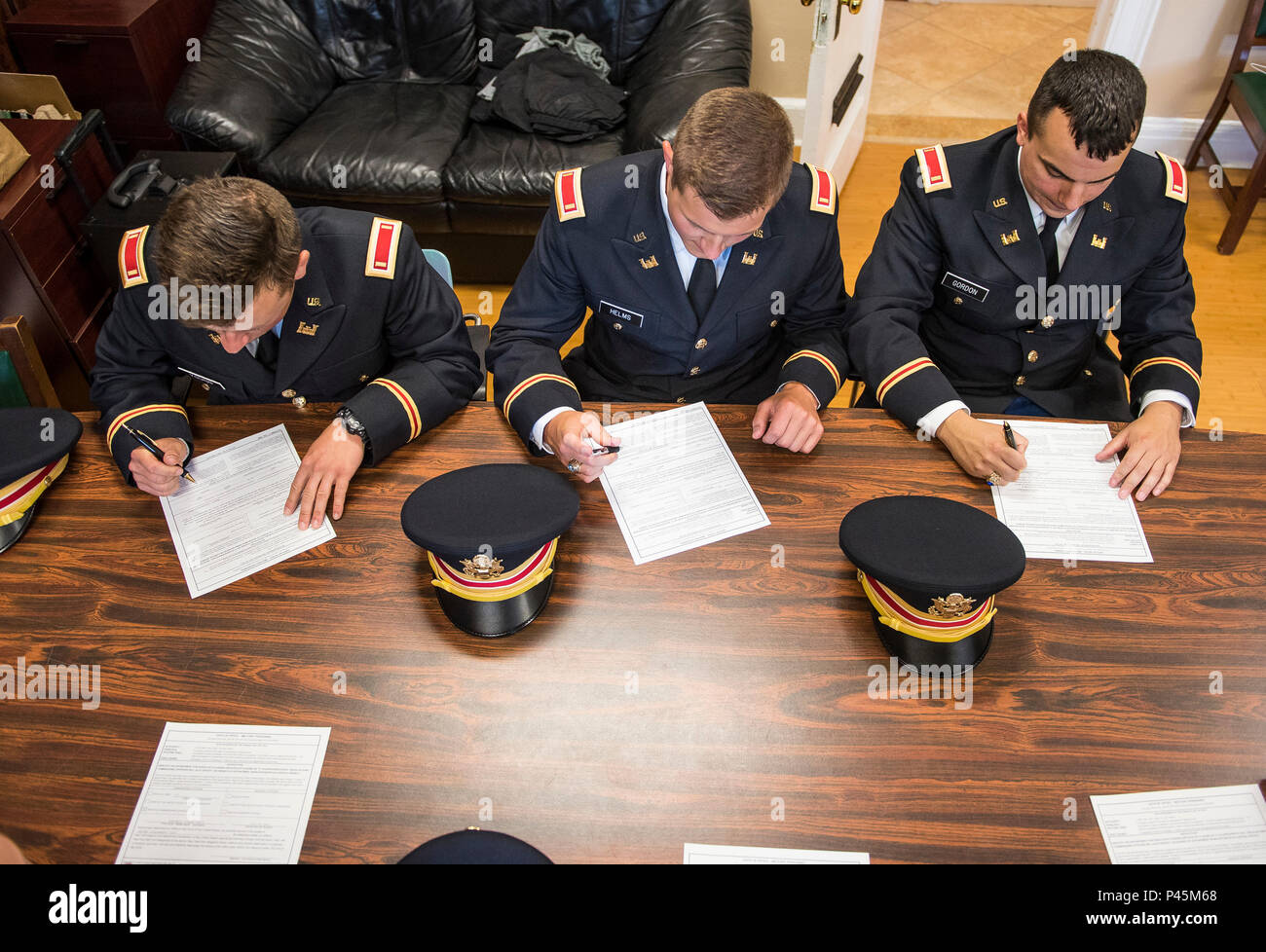 A group of newly commissioned U.S. Army lieutenants sign the Oath of ...