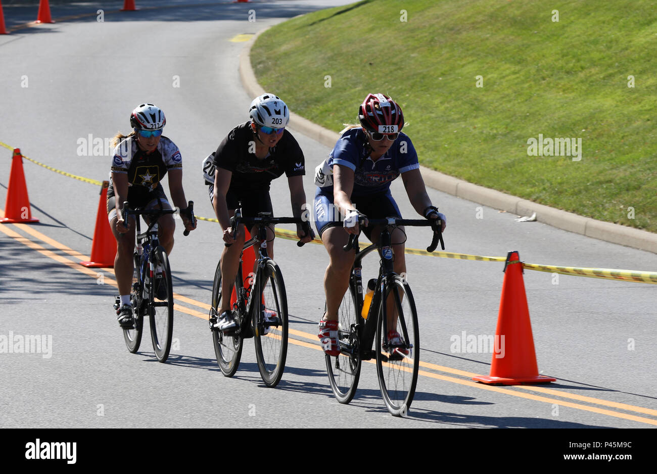 Cyclists competing in the Women’s 10k cycling race charge toward the ...