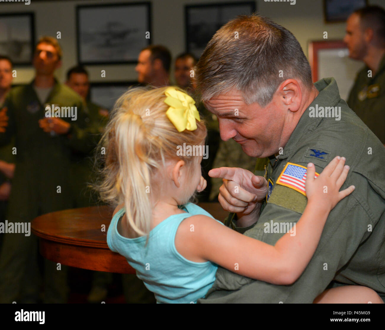 Col. Douglas DeLaMater, 374th Airlift Wing commander, plays with his ...