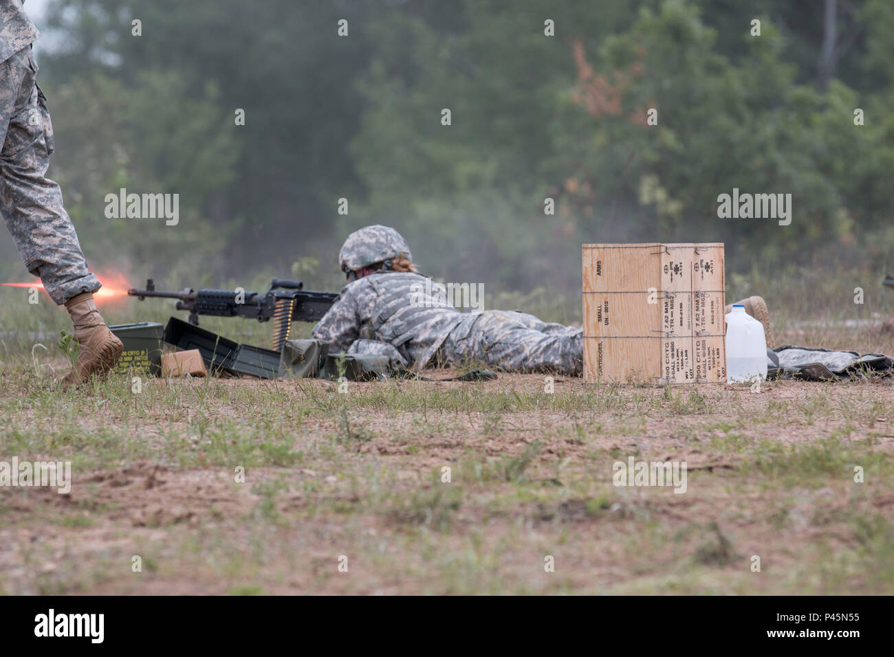 A 34th Combat Aviation Brigade Soldier fires a M240 machine gun during ...