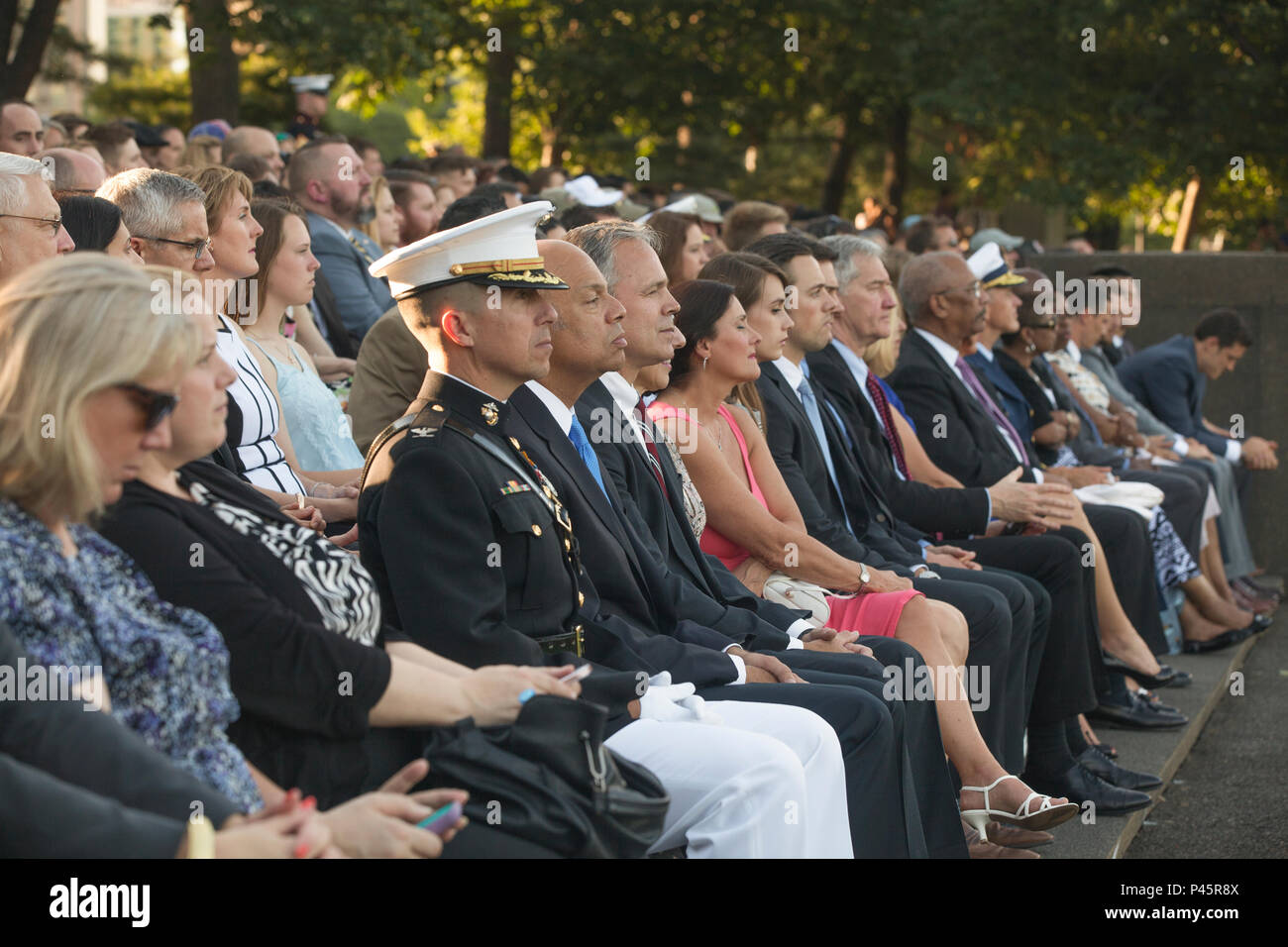 Guests await before a sunset parade at the Marine Corps War Memorial ...