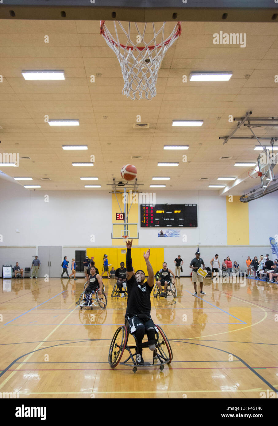 U.S. Army Veteran, Spc. Darron Lewis, of Cleveland Ohio, shoots a free ...