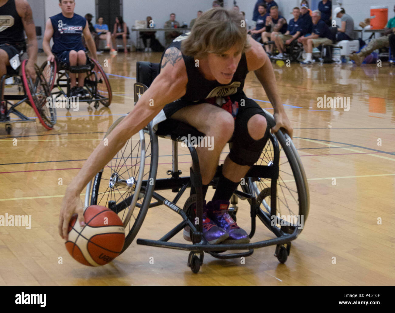 U.S. Army Veteran, Spc. Terry Cartwright, competes in a wheelchair ...