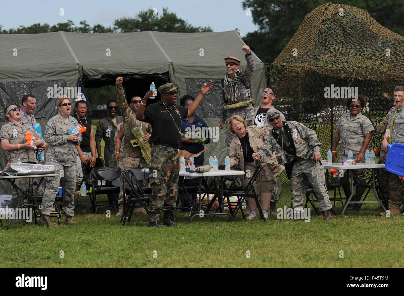 Members of the 81st Communications Squadron yell a chant for roll call ...