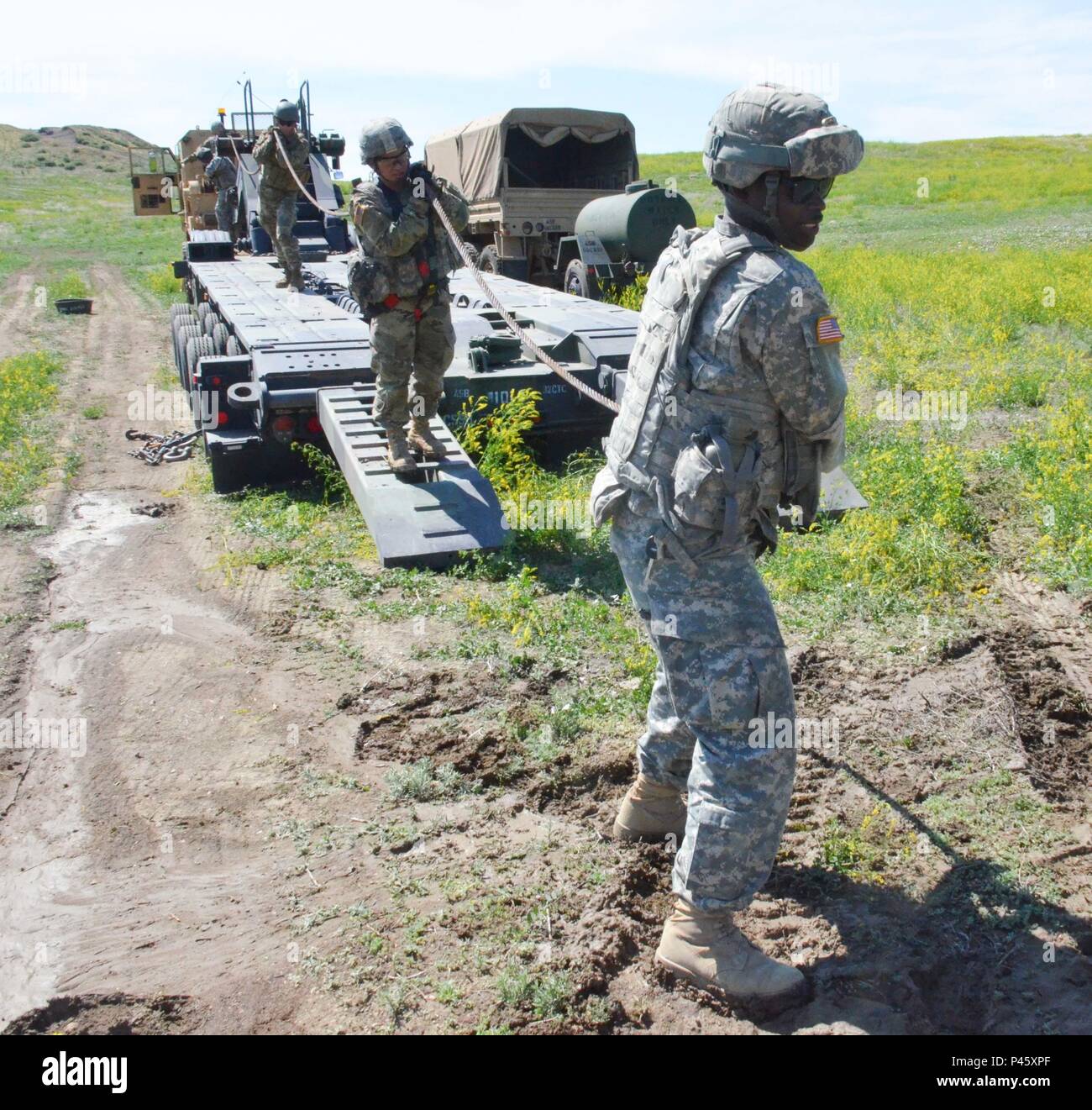Soldiers perform a vehicle recovery task June 9, 2016, as part of a two ...