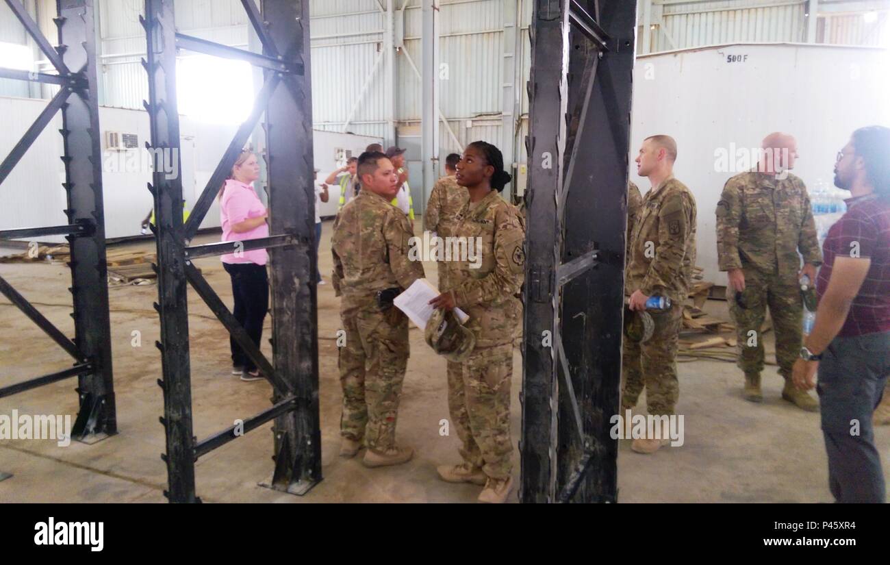 1st Lt. Ivana Williams, center, the officer in charge of Camp Taji ...