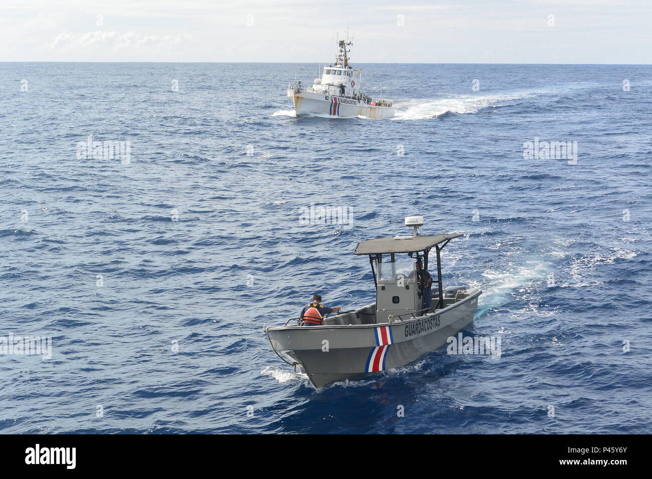 Costa Rican coast guard approach the Cutter Alert to embark four ...