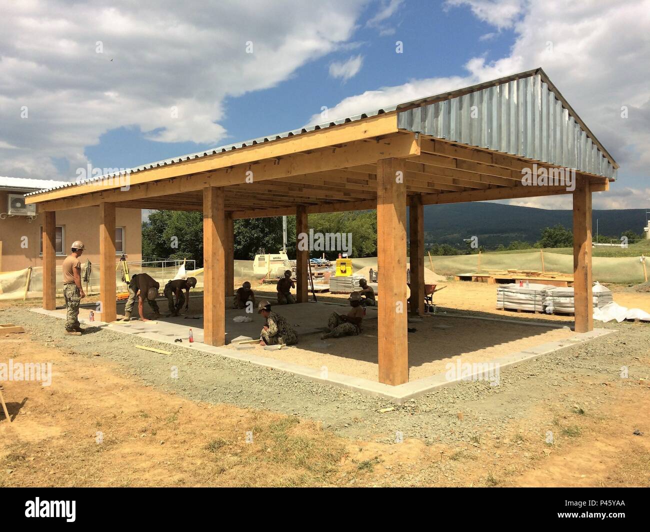 Navy Seabees from Naval Construction Battalion 133 construct a pavilion ...