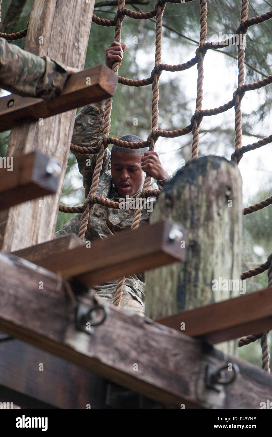 A Soldier reaches the end of “the Tough One” obstacle as part of the ...