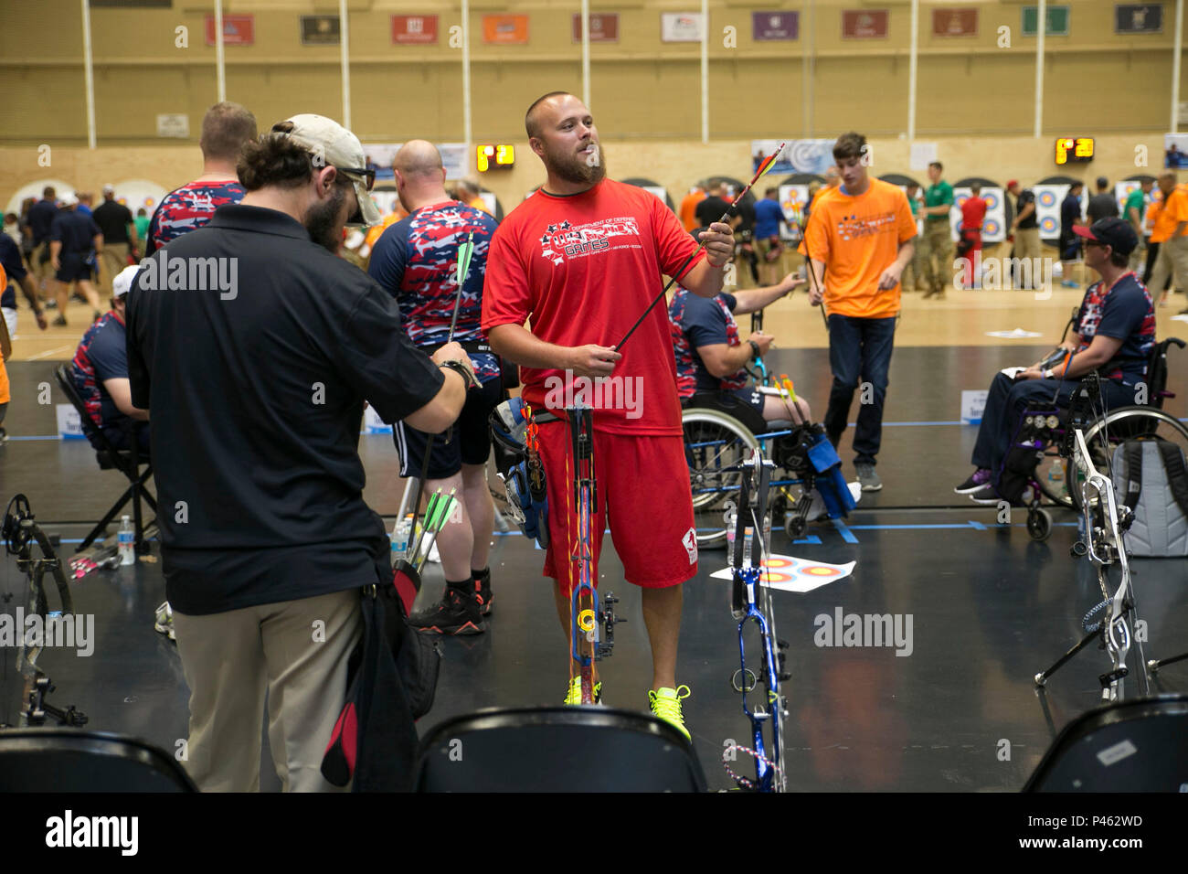 U.S. Marine Corps veteran Clayton McDaniel inspects an arrow during the ...