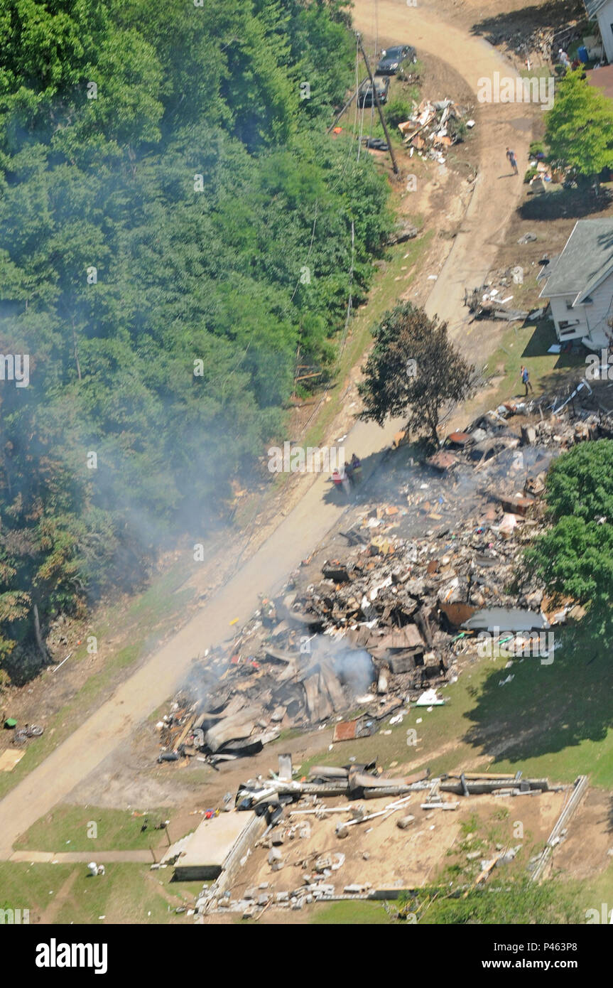 Smoke is captured coming from a family's home in the White Sulphur ...