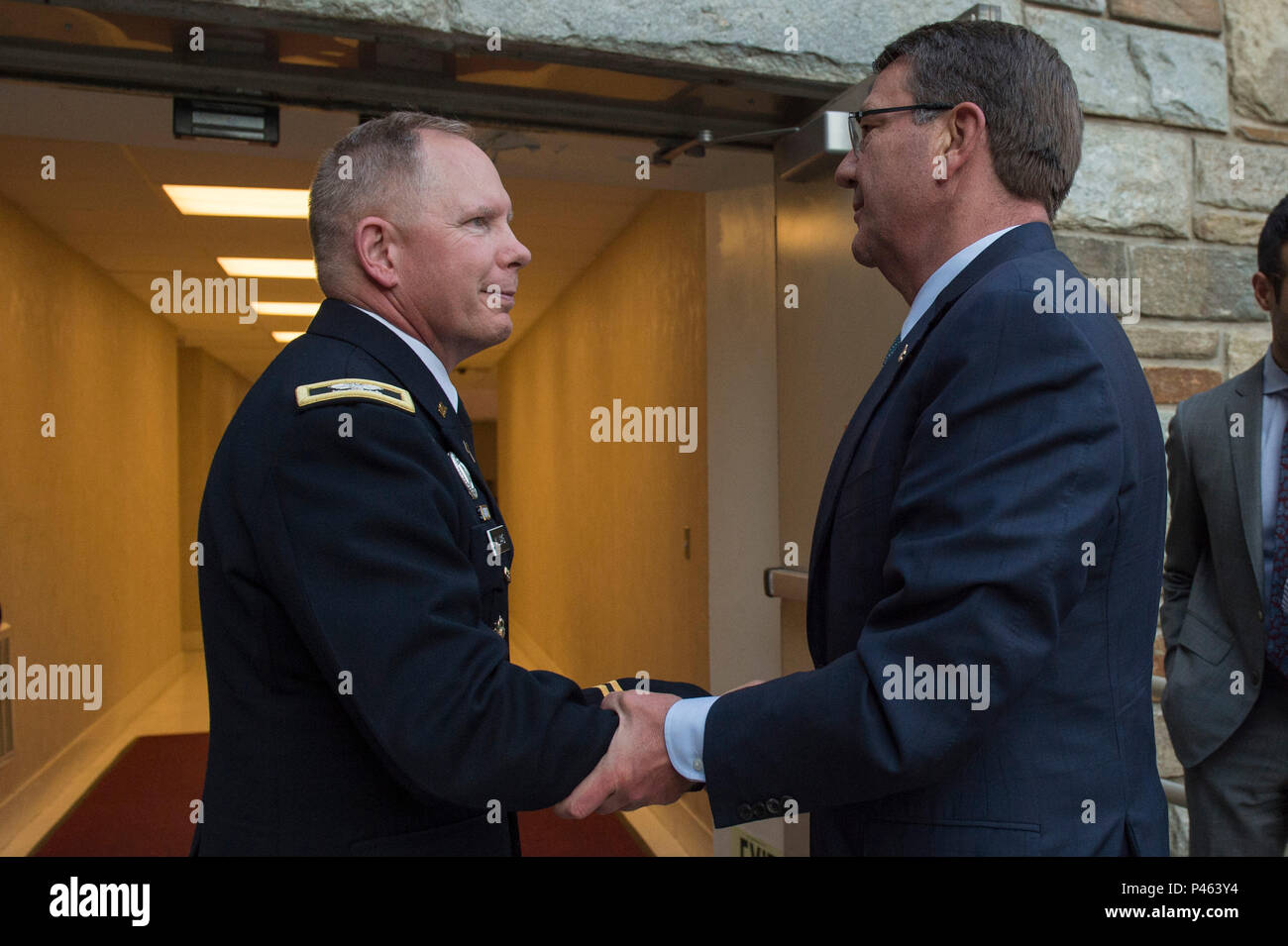 Secretary of Defense Ash Carter is greeted by Pentagon Chaplain Col ...