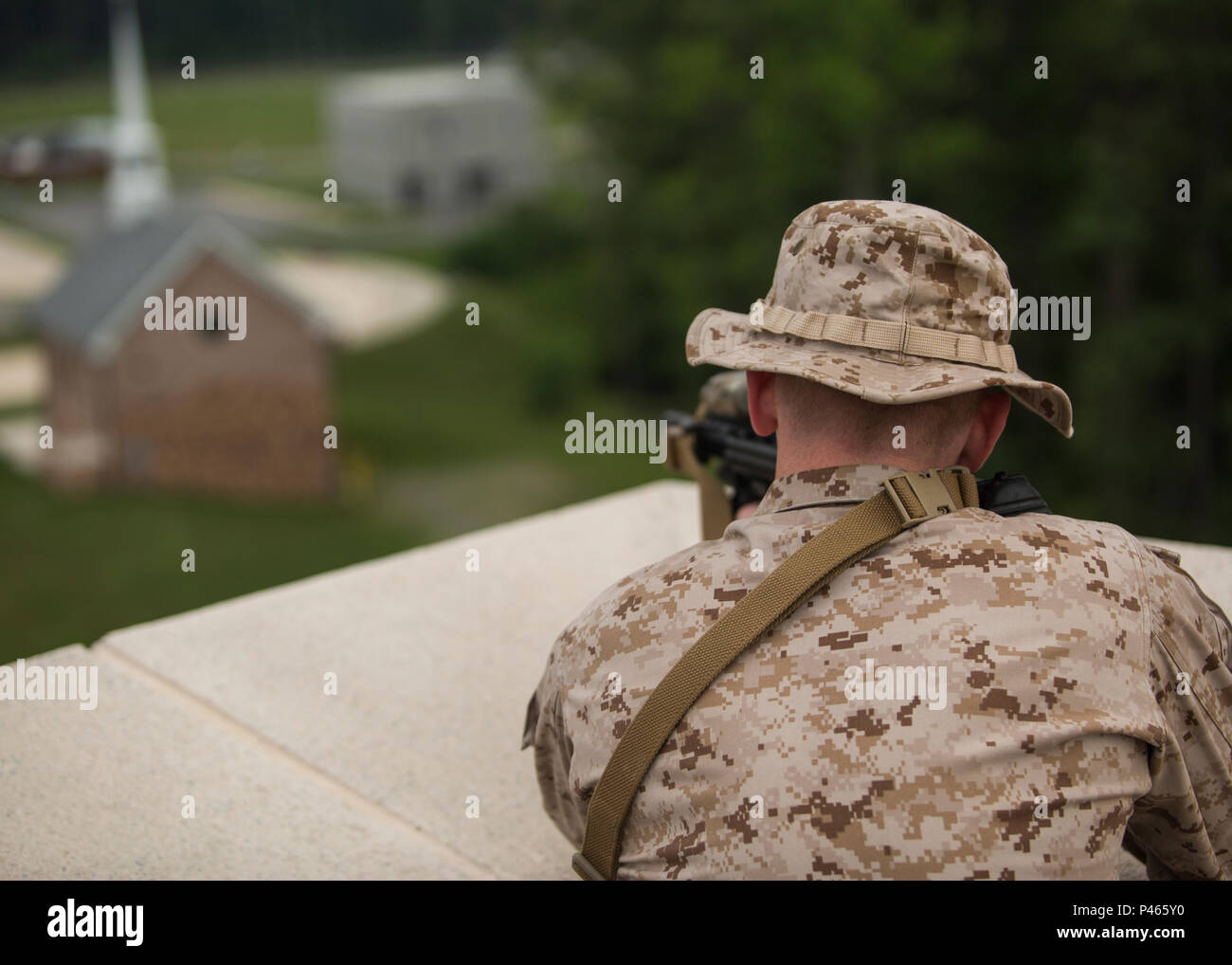 A Marine assigned to a Marine Security Augment Unit posts security on ...