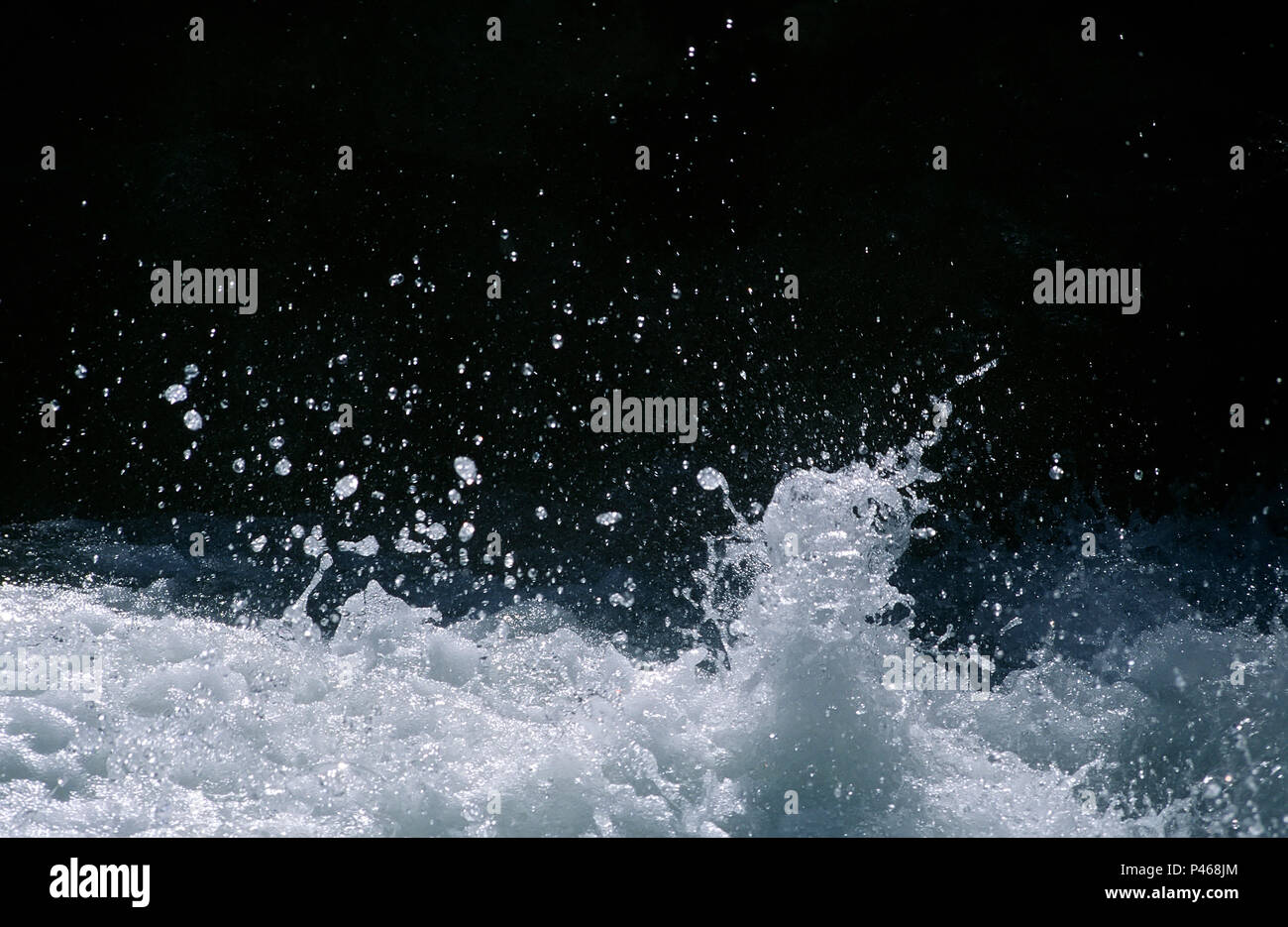 Splashing stream drops Stock Photo - Alamy