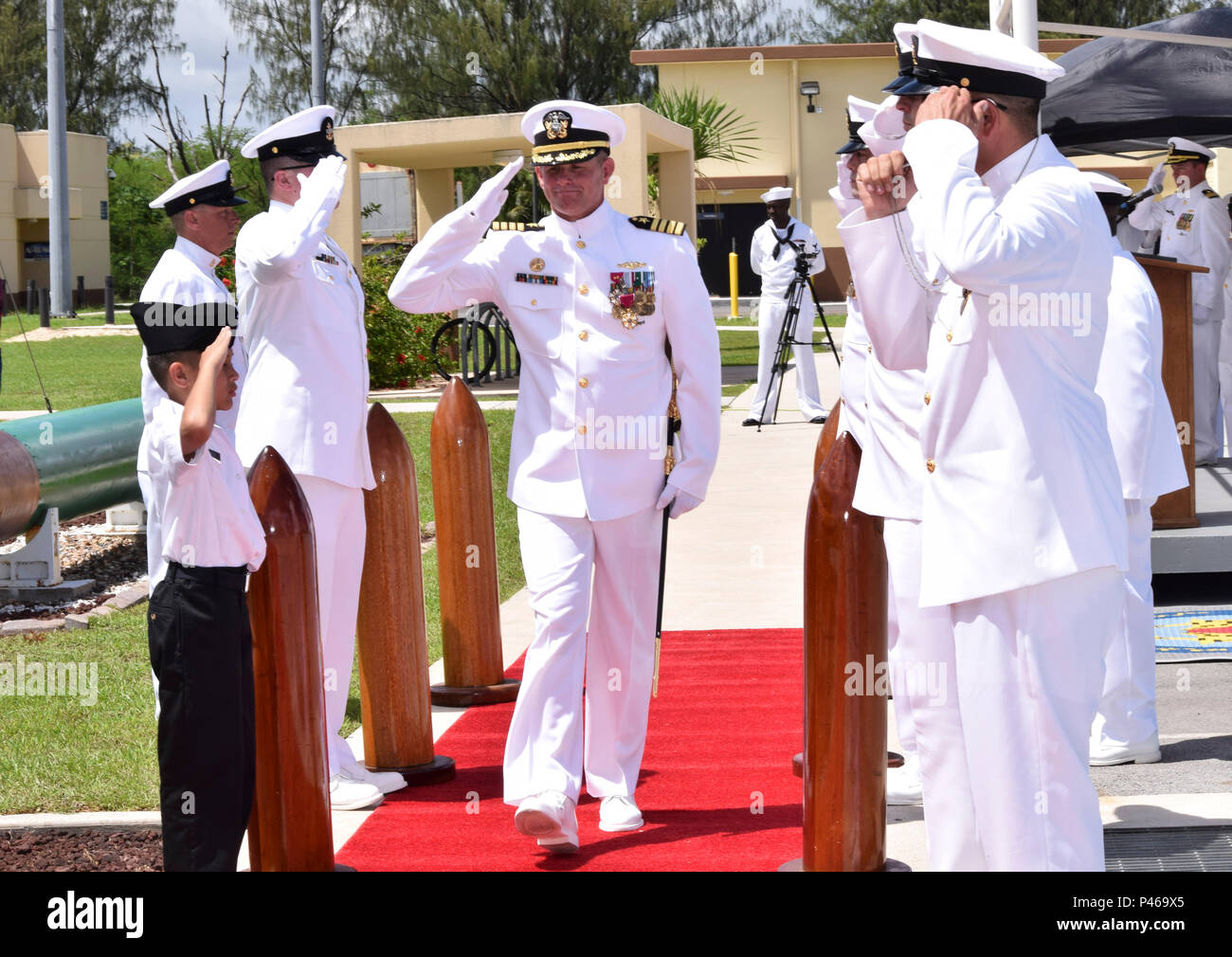SANTA RITA, Guam (June 20, 2016) – Capt. Jeffrey M. Grimes salutes the ...