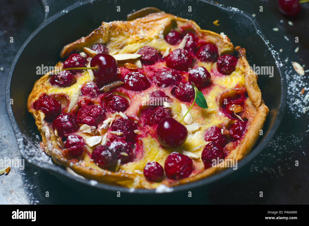 Cherry Dutch Baby, Puff German Pancake on Vintage Pans and Dark ...